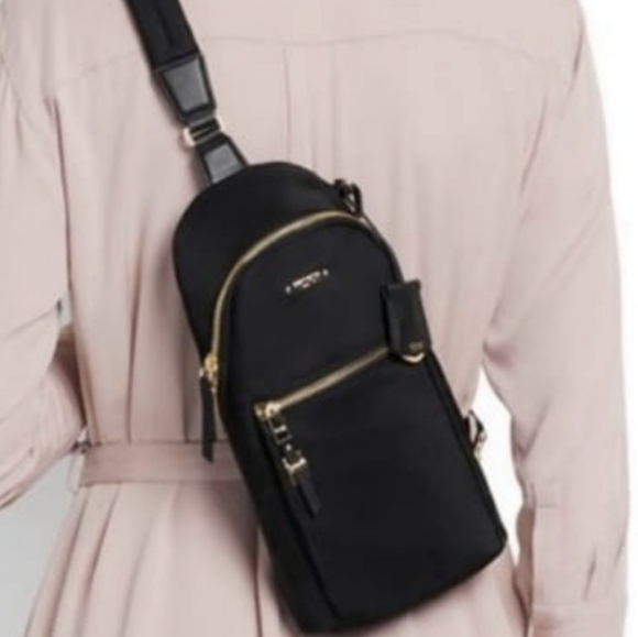 Tumi | Bags | Tumi Voyageur Ariana Sling Bag In Black And Goldtone ...